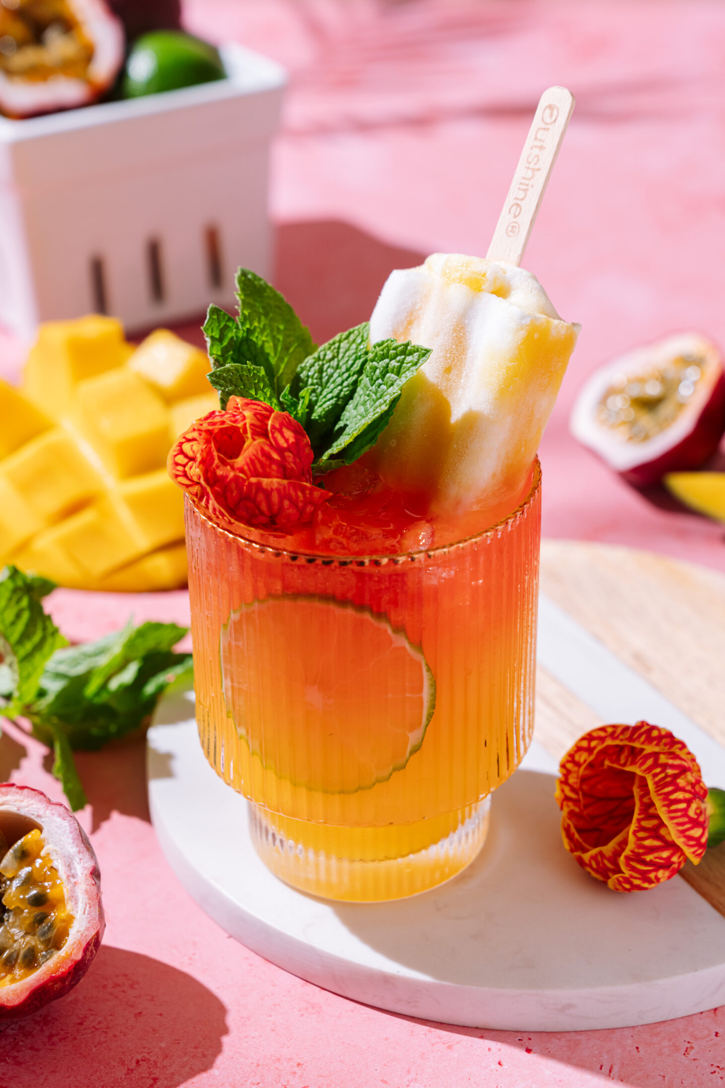 Tropical Punch No-jito (Hibiscus Mango Mojito Mocktail) - The Social Sipper